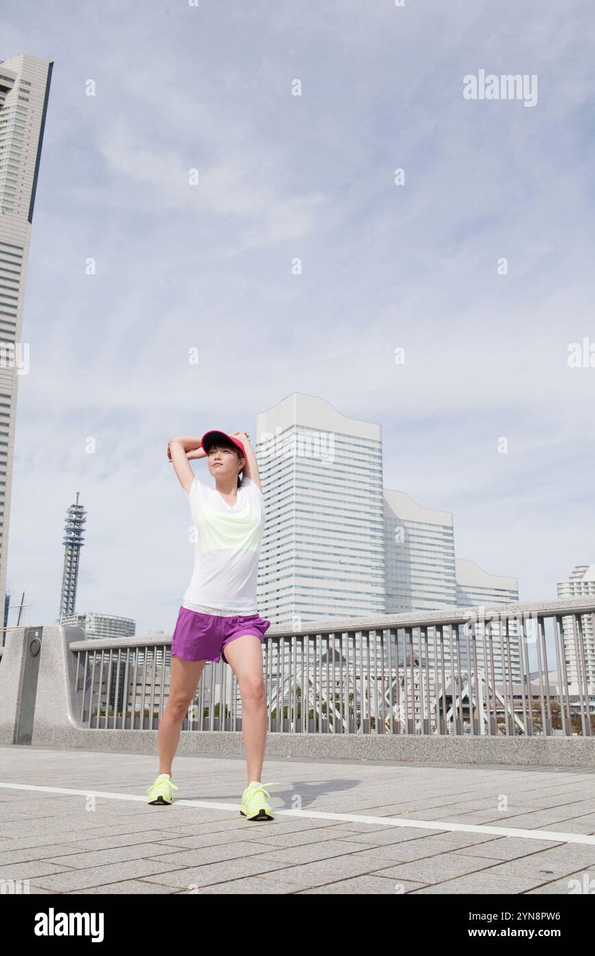Young women stretching Stock Photo - Alamy