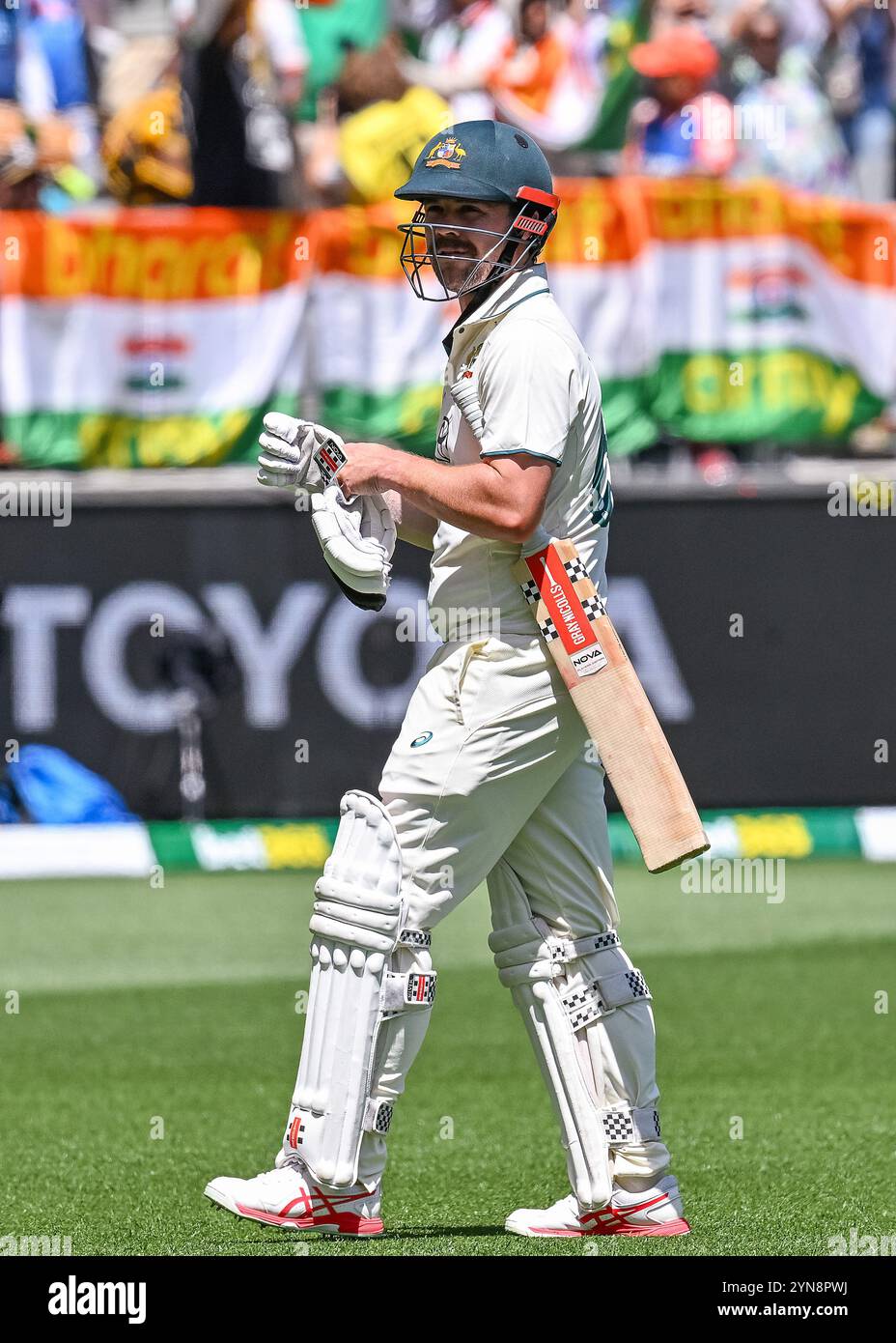Perth, Australia. 25th Nov, 2024. Travis Head of Australia walks to the ...