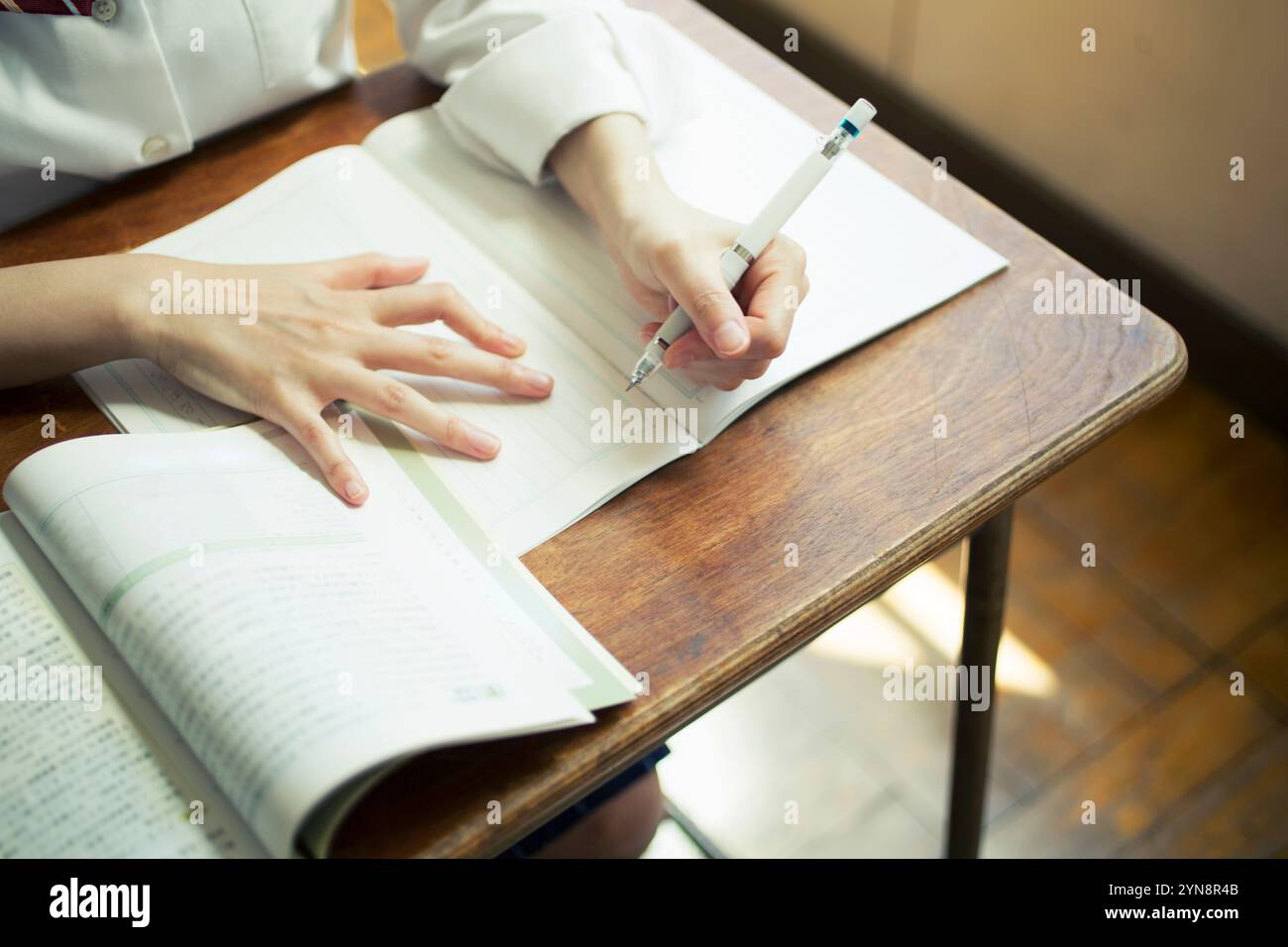 High school girl taking notes in hand Stock Photo - Alamy