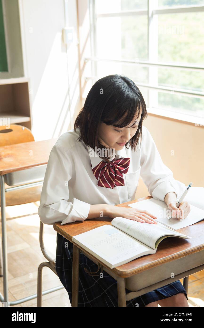 Female high school student in class Stock Photo - Alamy