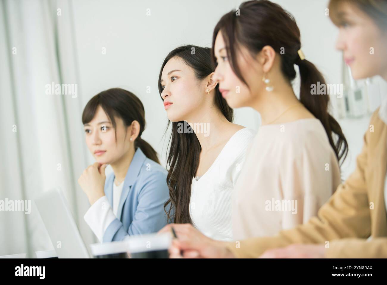 Four women in their 20s being interviewed Stock Photo - Alamy