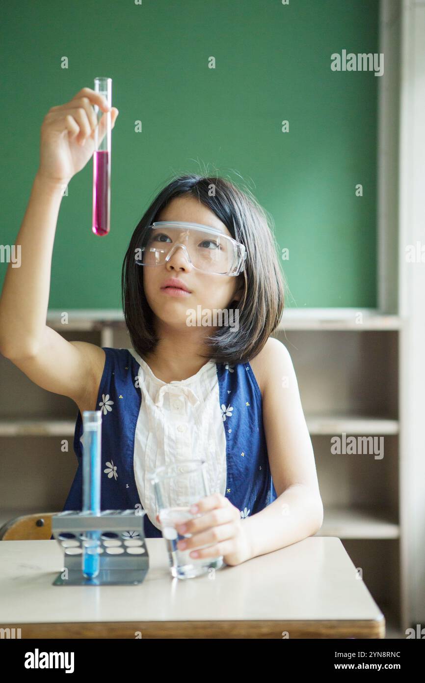 Primary school girl doing a science experiment Stock Photo - Alamy
