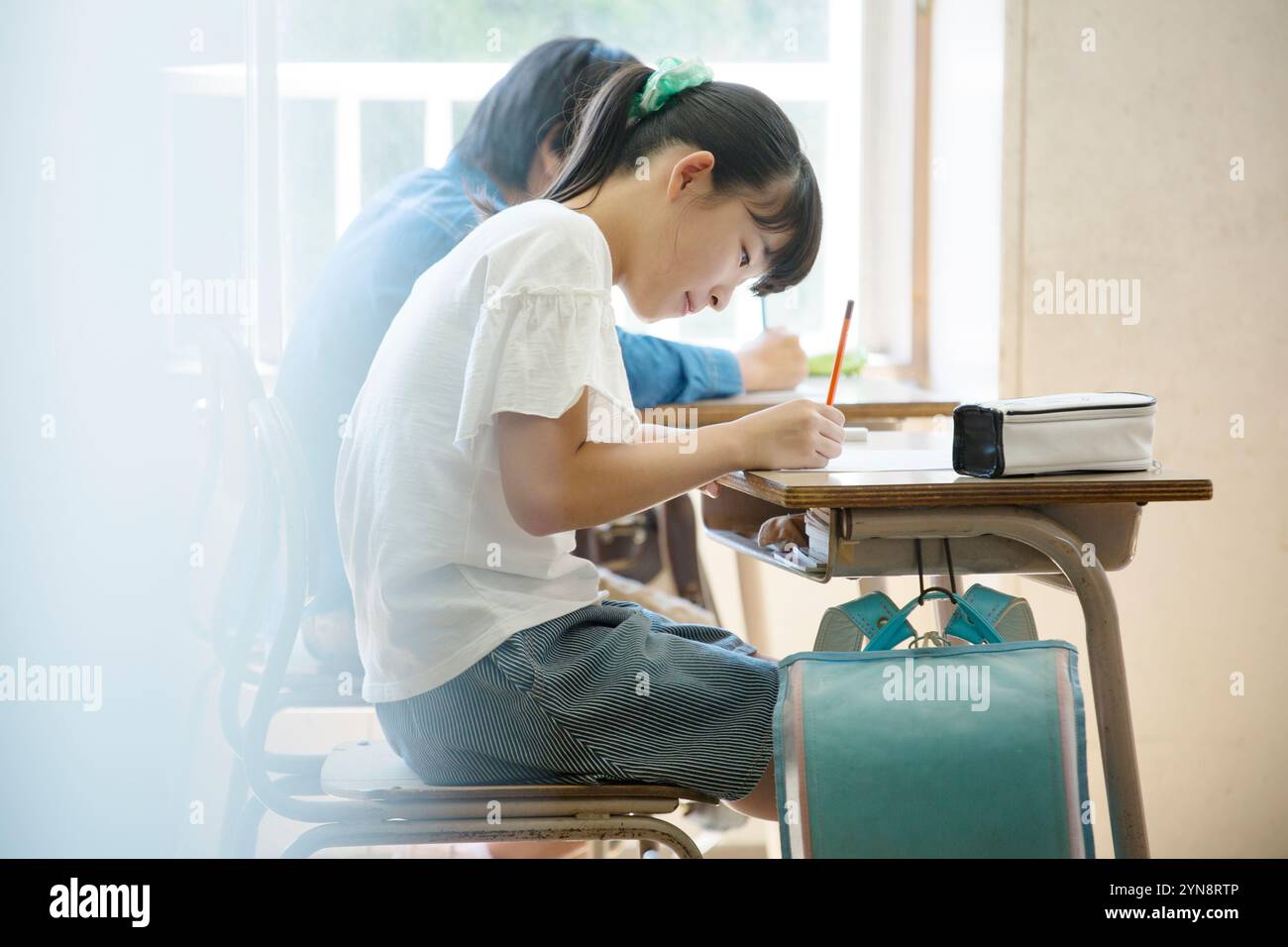 Men and women studying in a classroom Stock Photo - Alamy