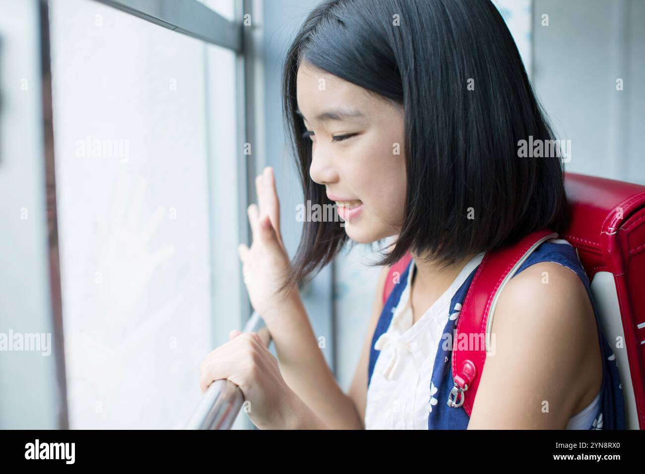 Primary schools girl looking outside Stock Photo - Alamy