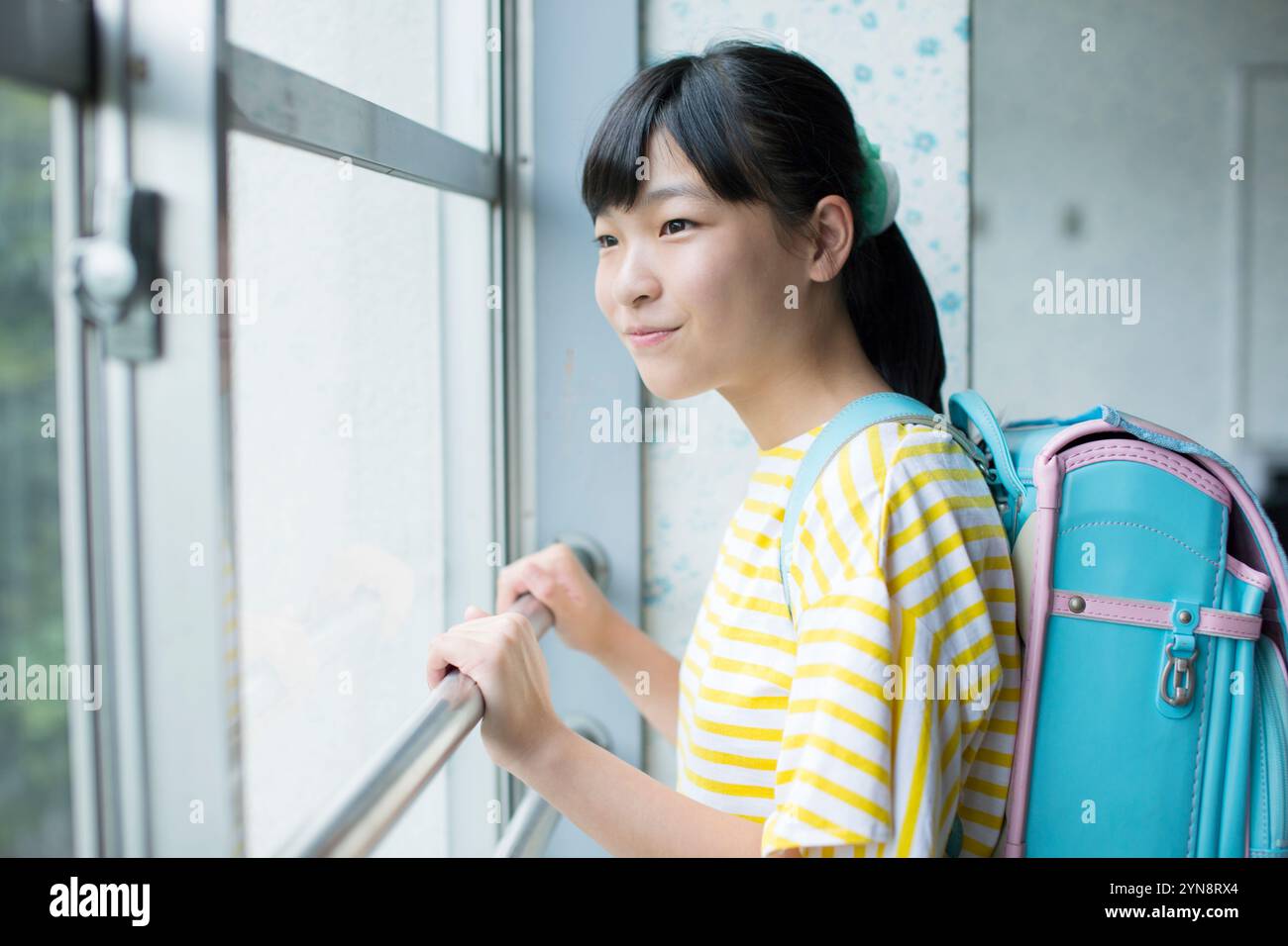 Primary schools girl looking outside Stock Photo - Alamy
