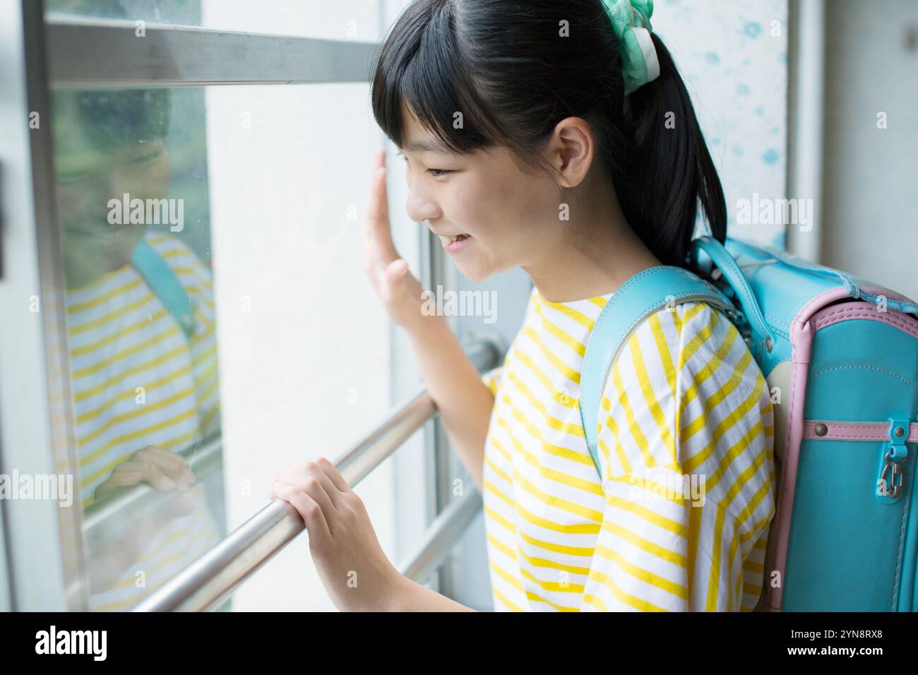 Primary schools girl looking outside Stock Photo - Alamy