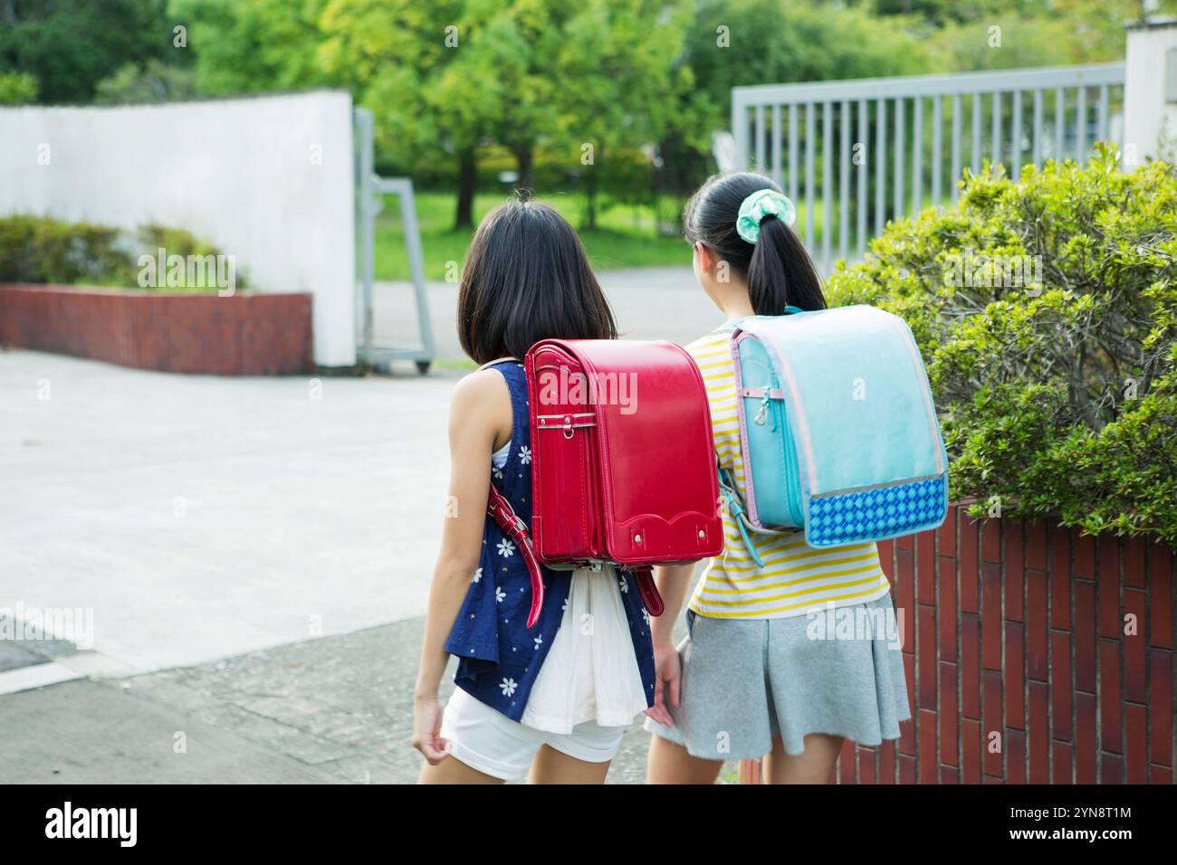 Primary schools girl going to school Stock Photo - Alamy
