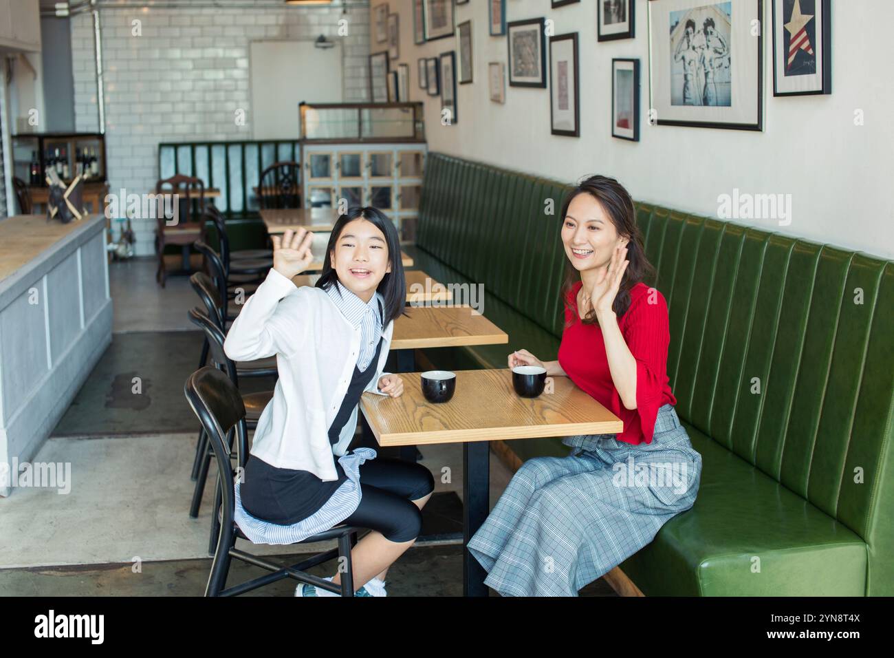 Parents and children waving at a rendezvous Stock Photo - Alamy