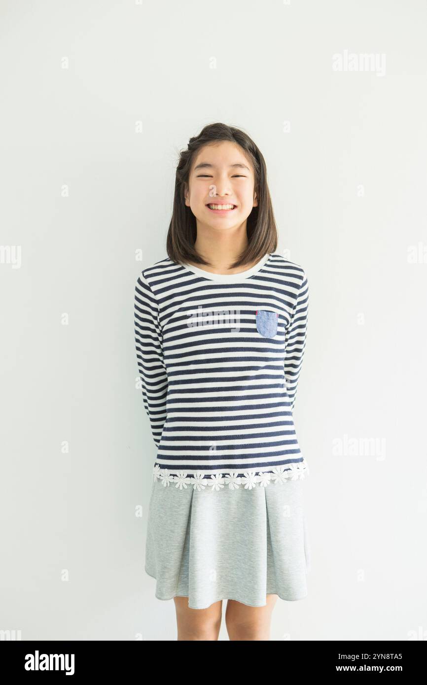 Smiling primary school girl portrait Stock Photo - Alamy
