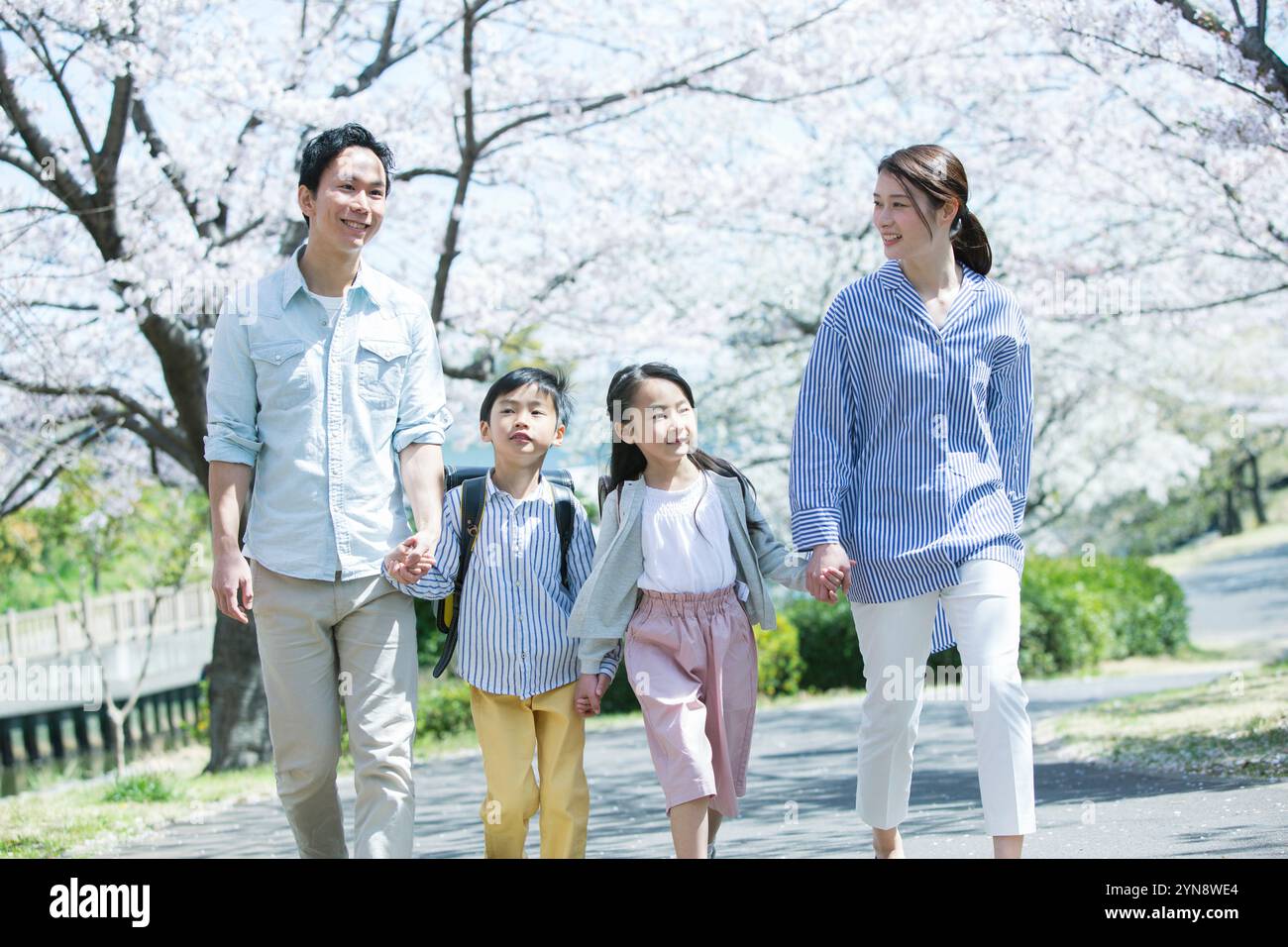 Children hold hands strolling along hi-res stock photography and images ...