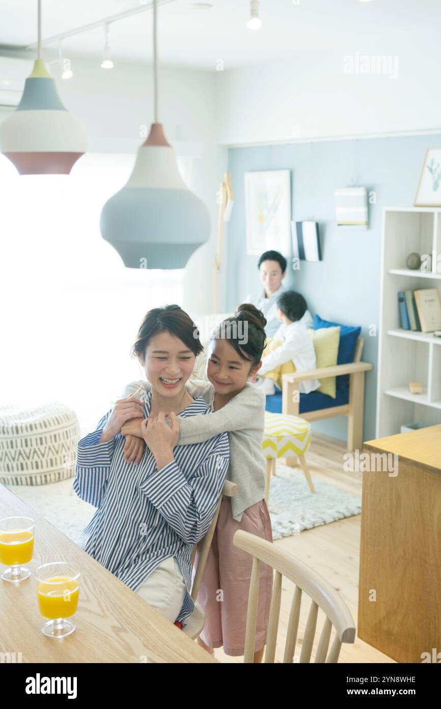 Happy family talking in the living room Stock Photo - Alamy