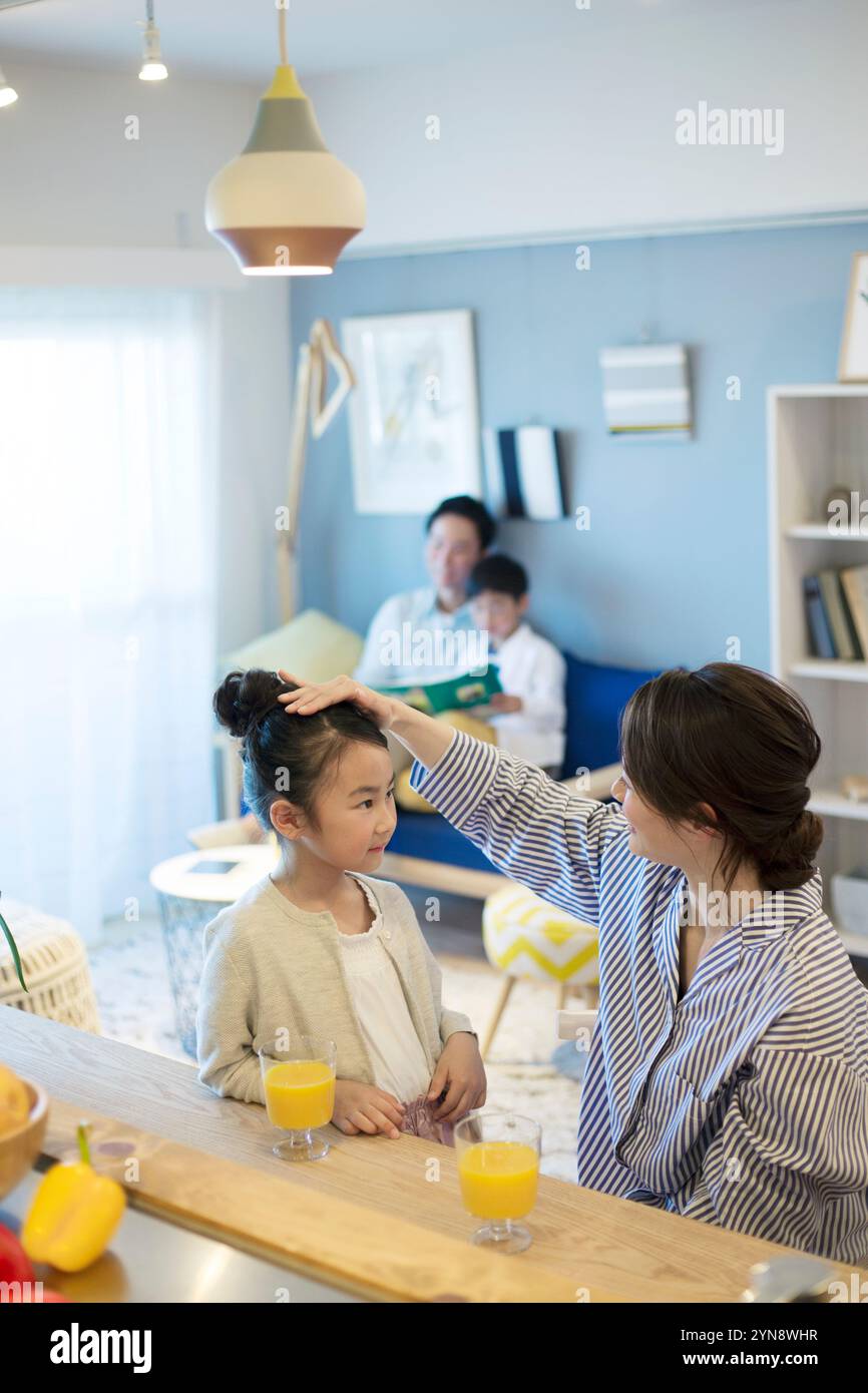 Happy family spending time in the living room Stock Photo - Alamy