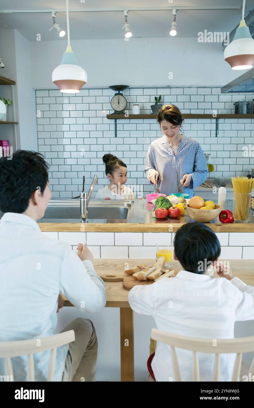 Happy family dining scene Stock Photo - Alamy
