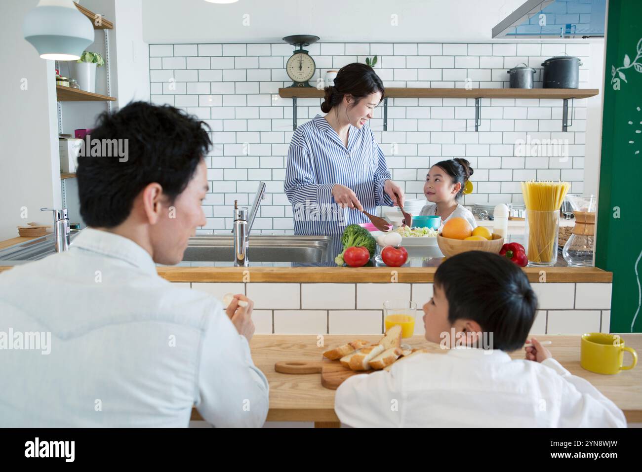 Happy family dining scene Stock Photo - Alamy