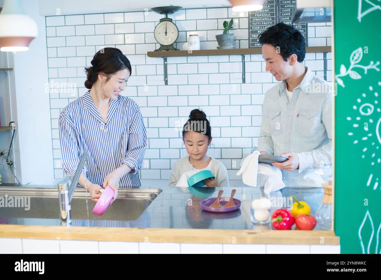 Smiling parents and children washing dishes Stock Photo - Alamy