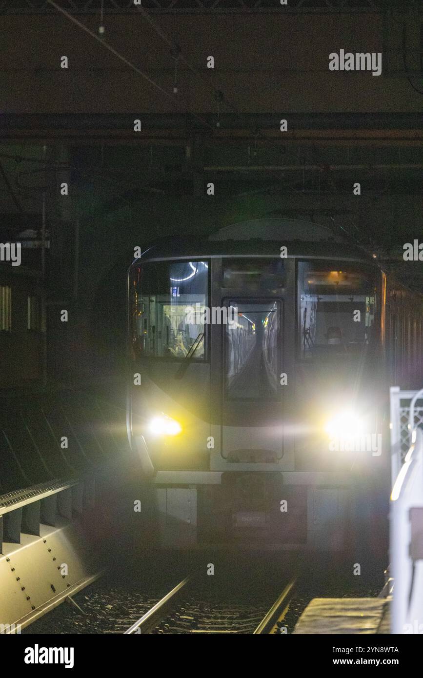 Subway Train Approaching Station at Night Stock Photo - Alamy