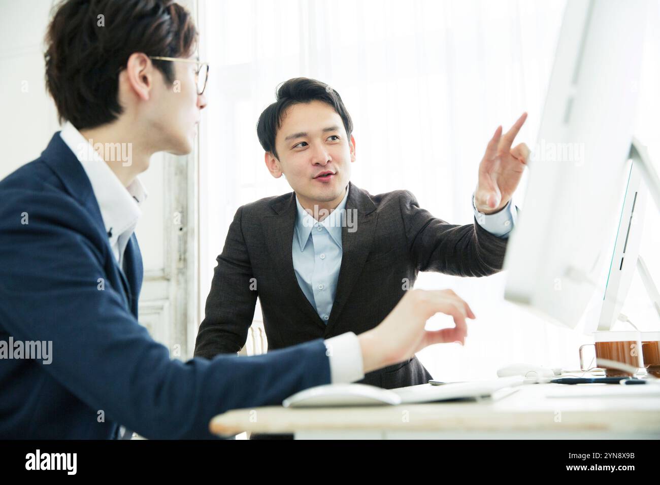 Computer desktop people pointing hi-res stock photography and images ...