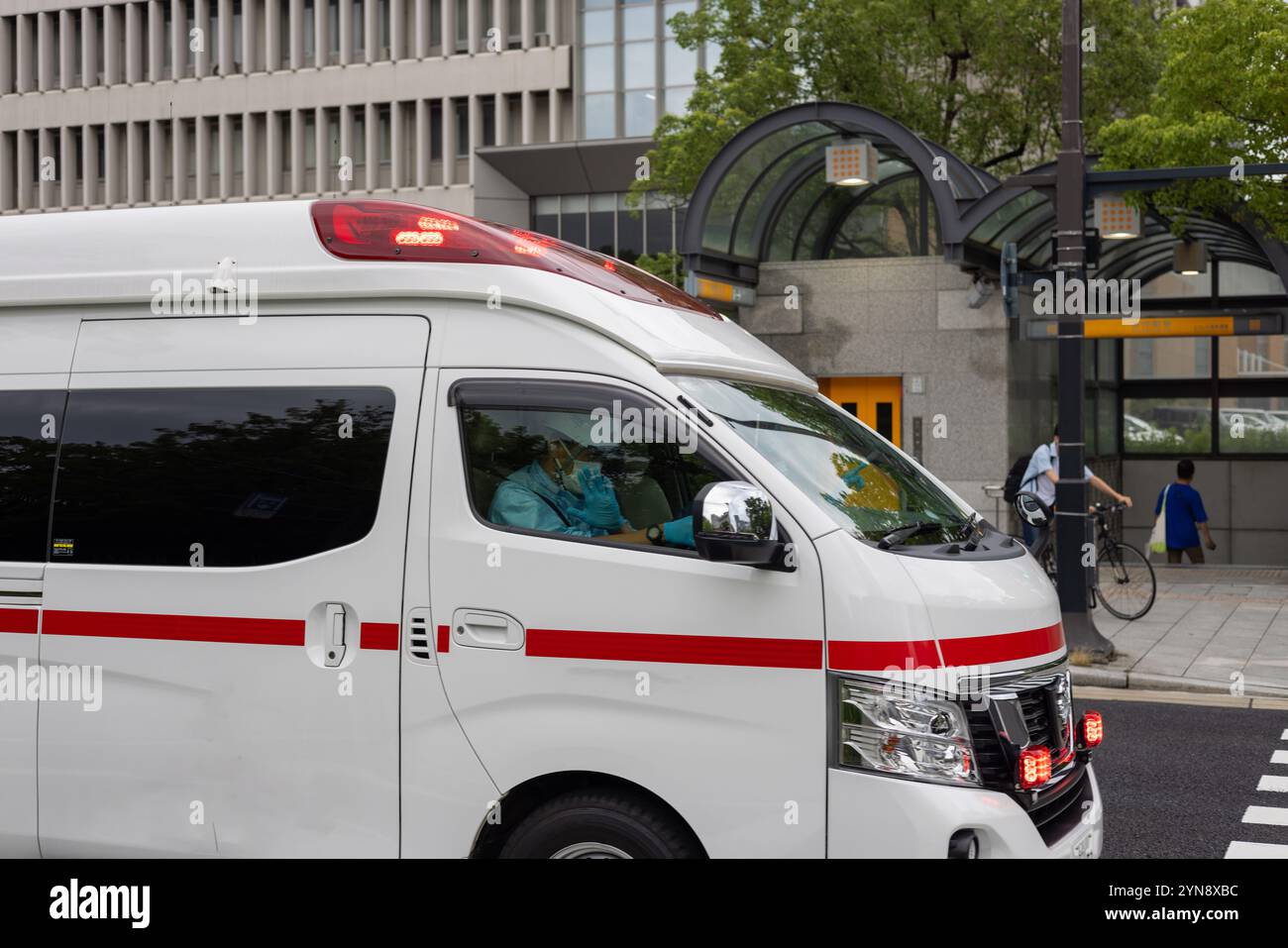 Emergency Ambulance on City Street Stock Photo - Alamy