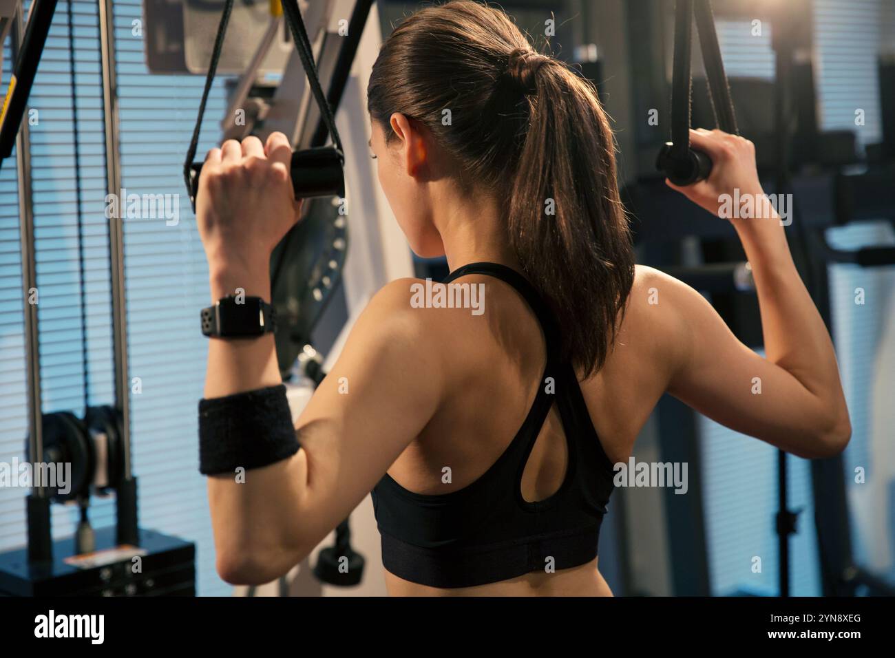 Back view of woman in training Stock Photo - Alamy