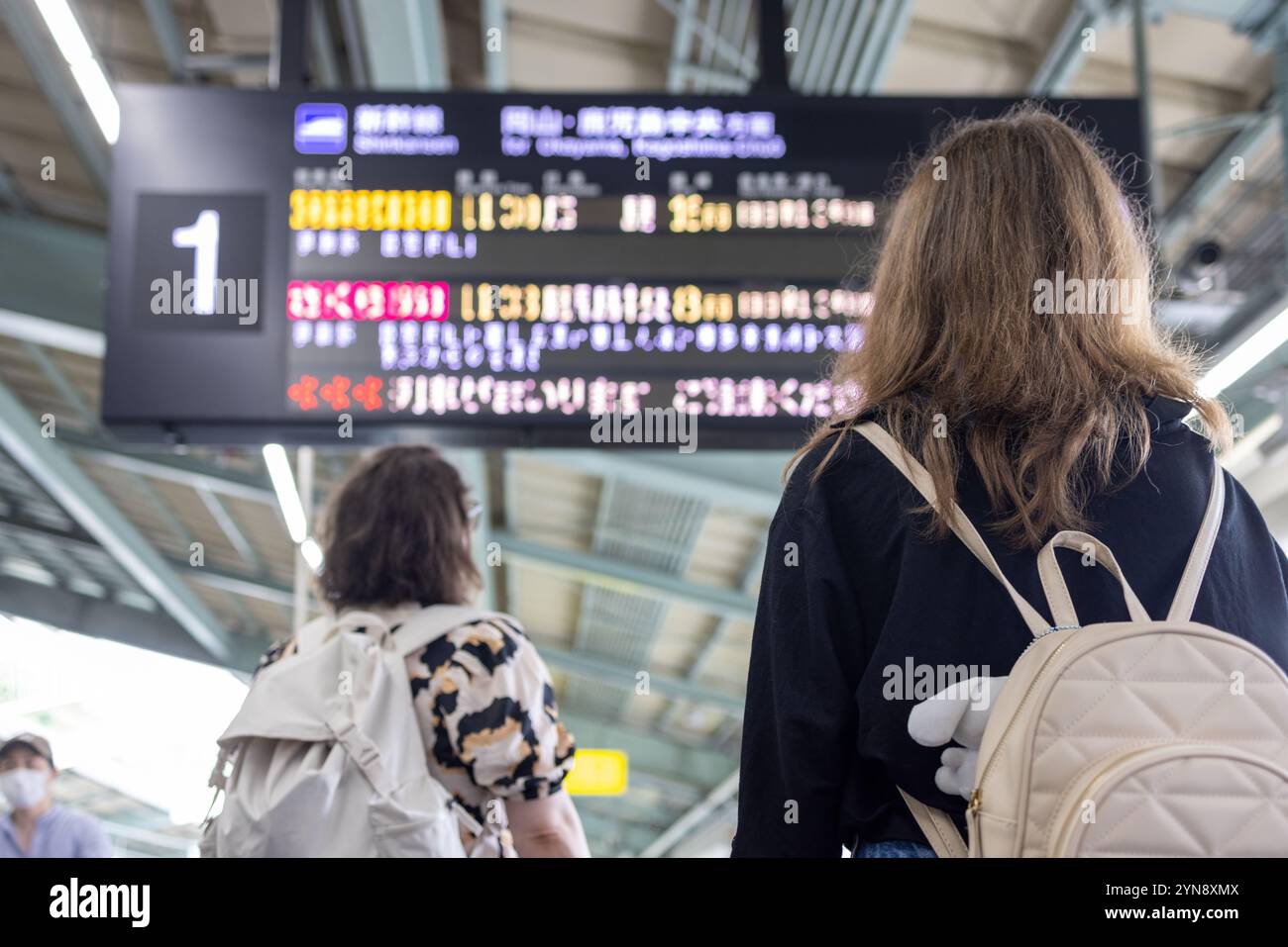 Travelers at Train Station Platform Reading Timetable Stock Photo - Alamy