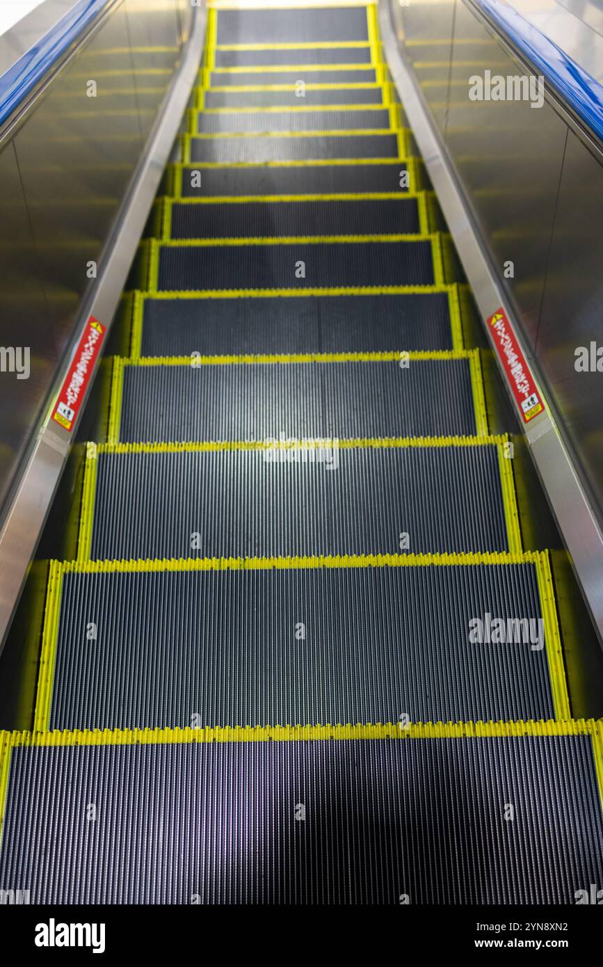 Close-Up View of an Escalator with Yellow Safety Markings Stock Photo ...