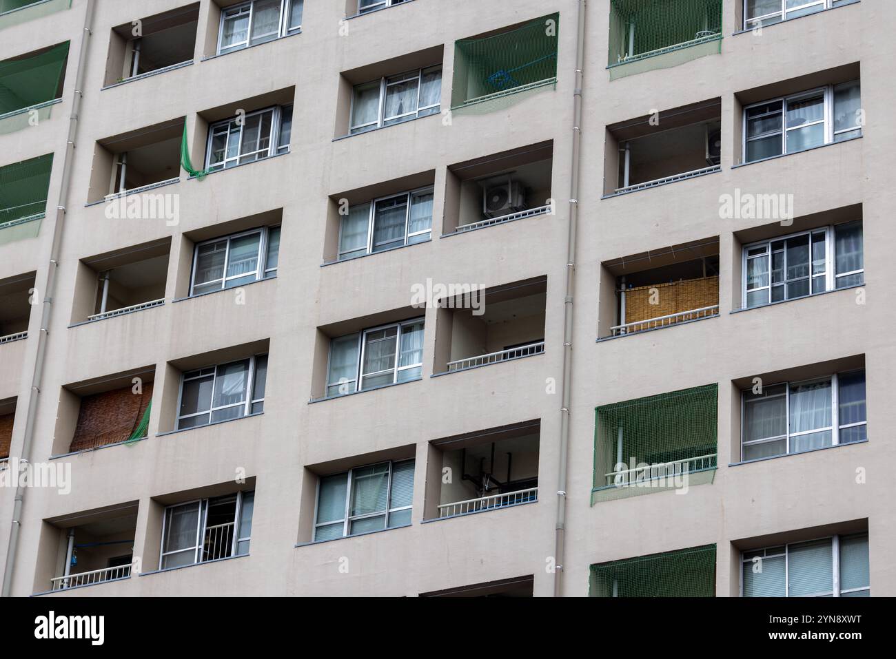 Apartment Building Facade with Open and Closed Windows Stock Photo - Alamy