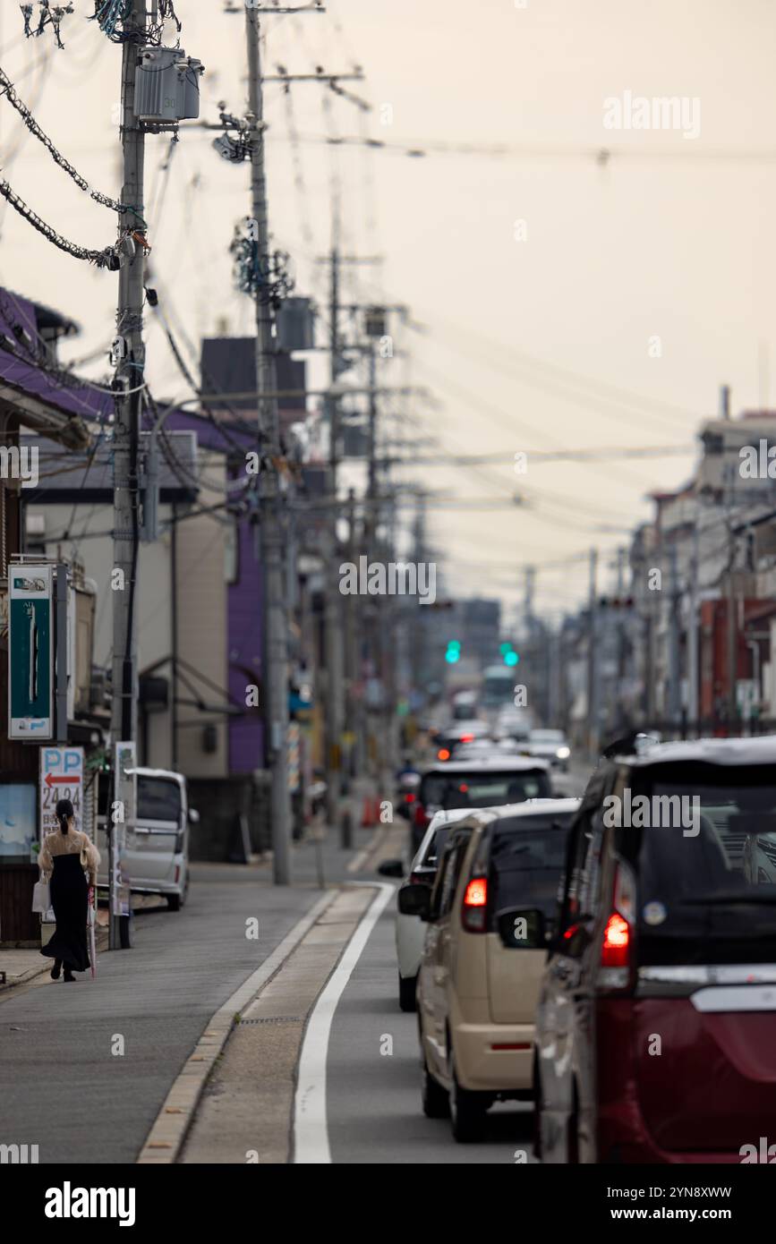 Busy Kyoto Street with Traffic and Power Lines Stock Photo - Alamy