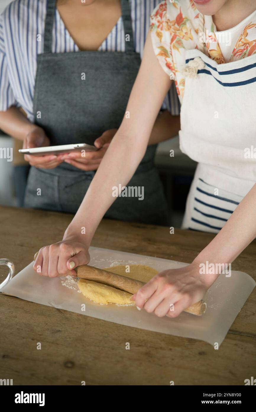 Woman's hand making sweets Stock Photo - Alamy