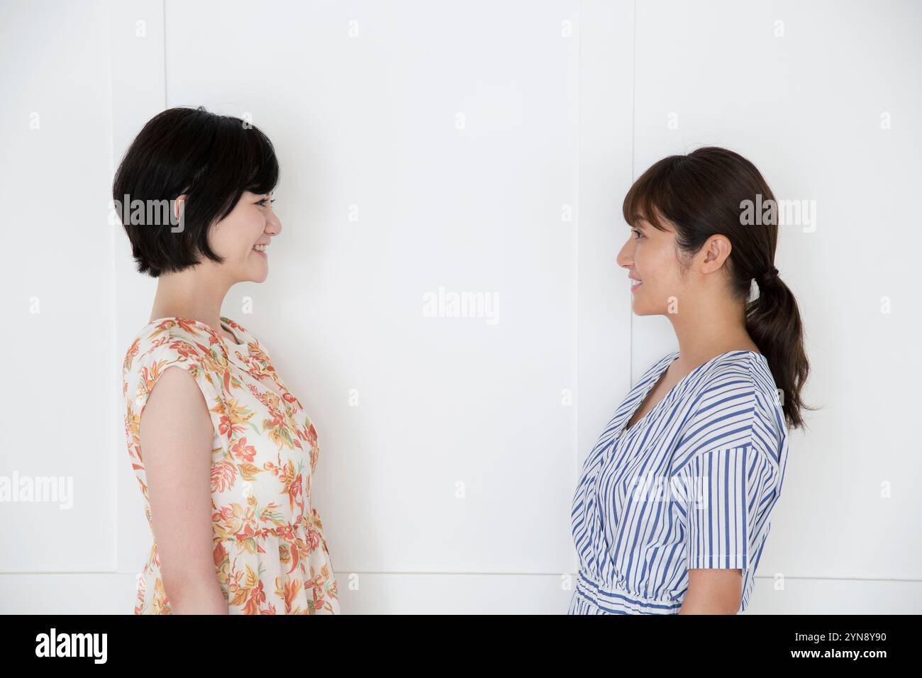 Two young women facing hi-res stock photography and images - Alamy