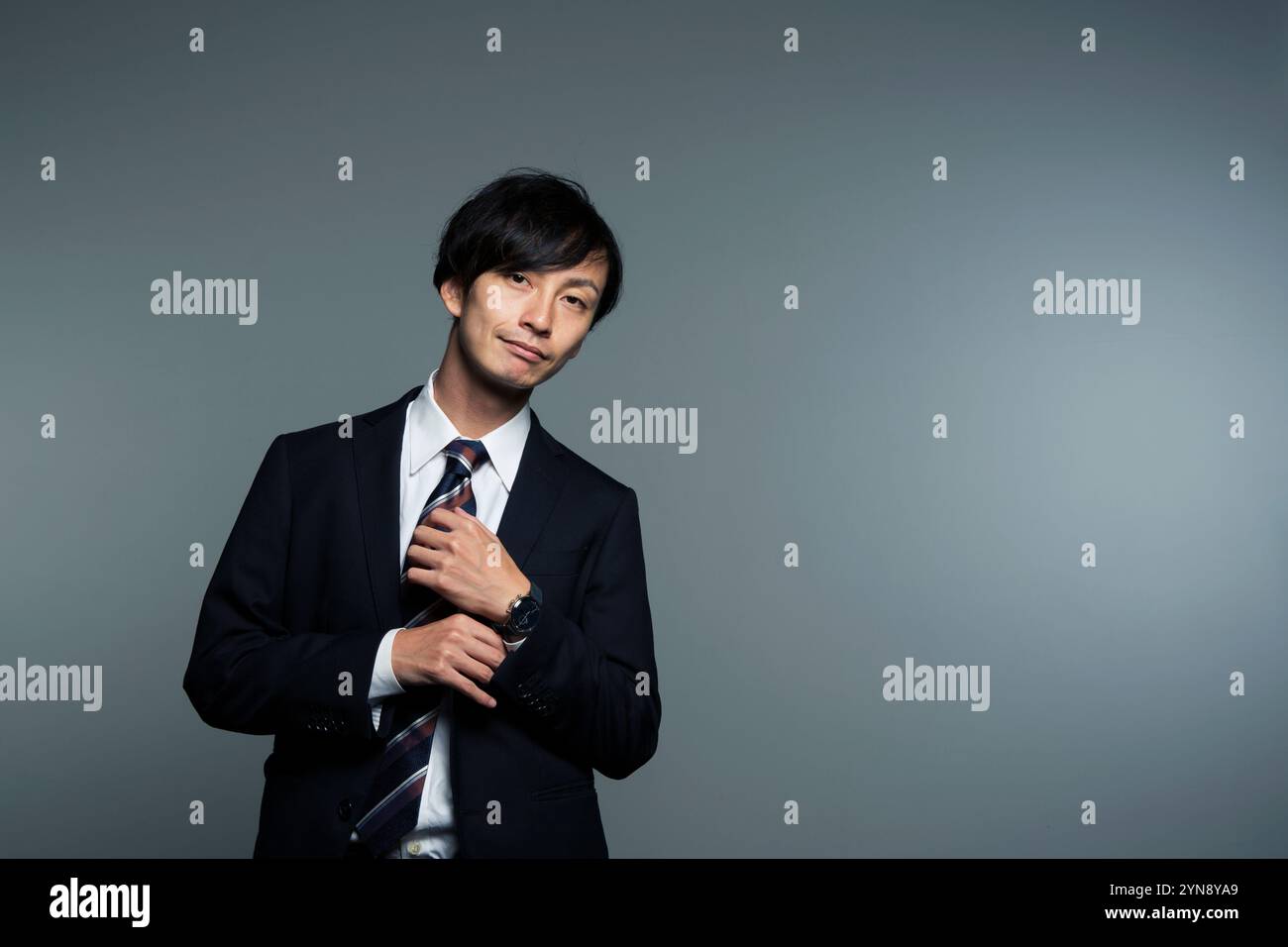 Portrait of camera-ready man in suit Stock Photo - Alamy