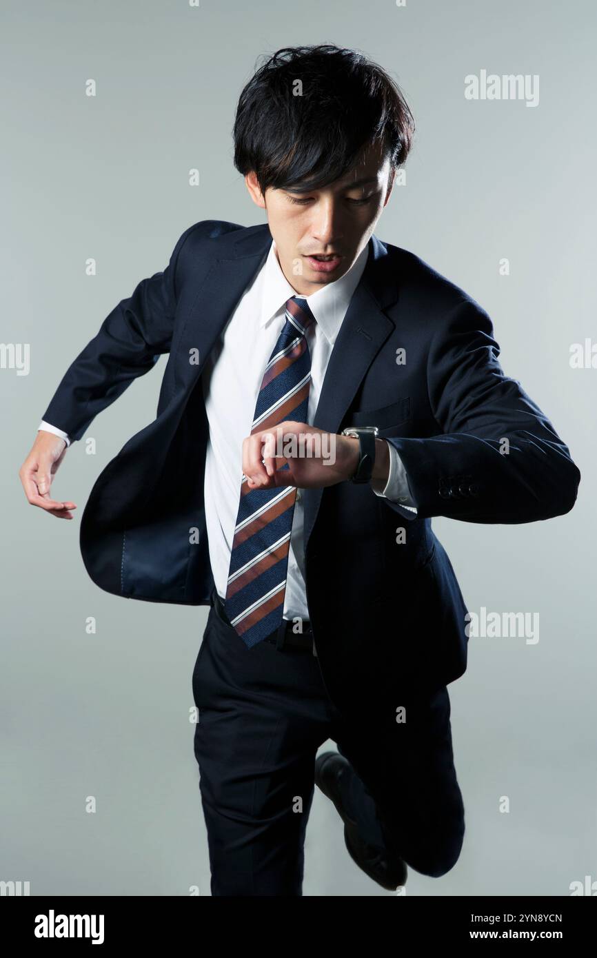 Man in suit running hi-res stock photography and images - Alamy