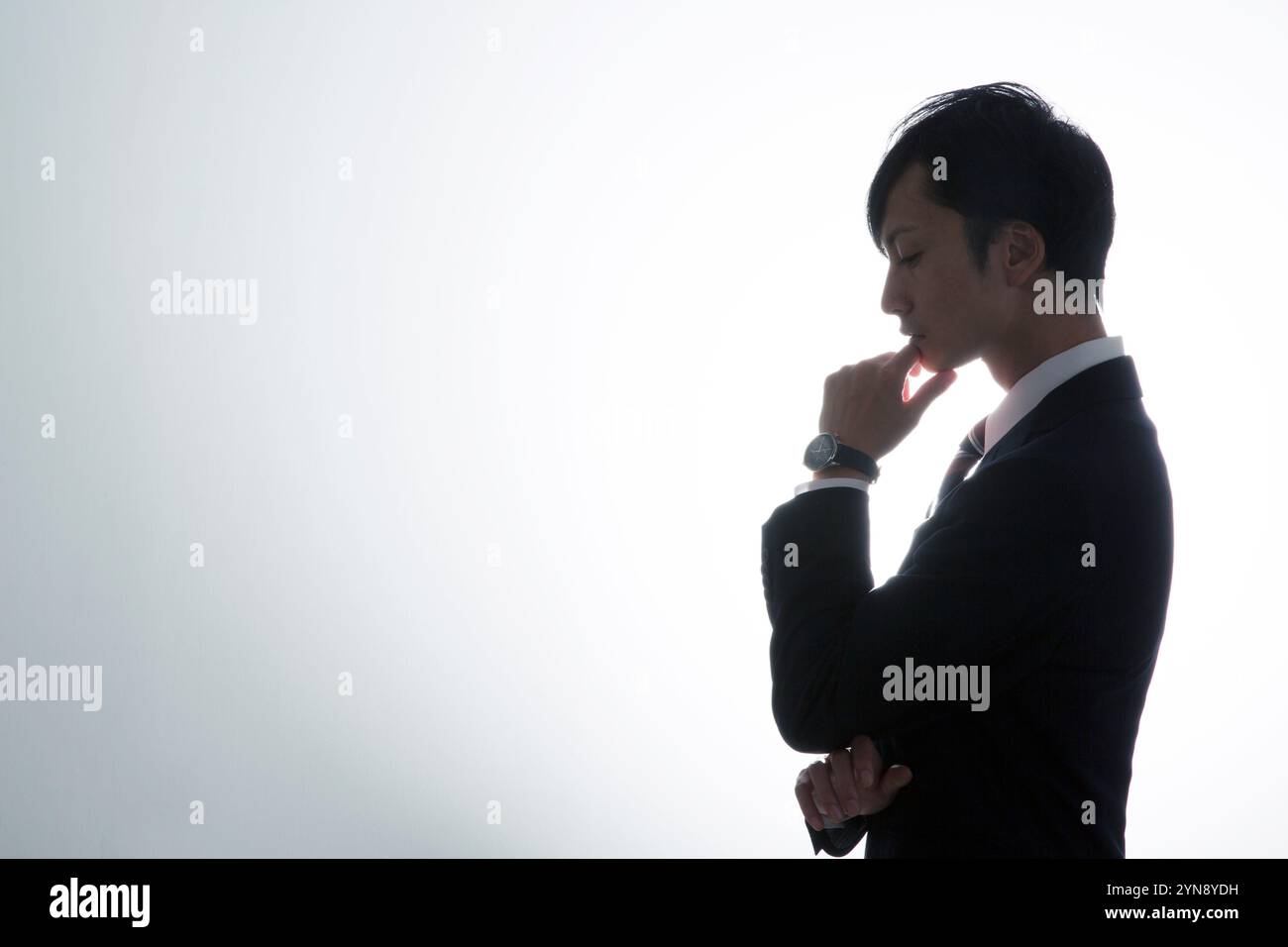 Thinking male profile Stock Photo - Alamy