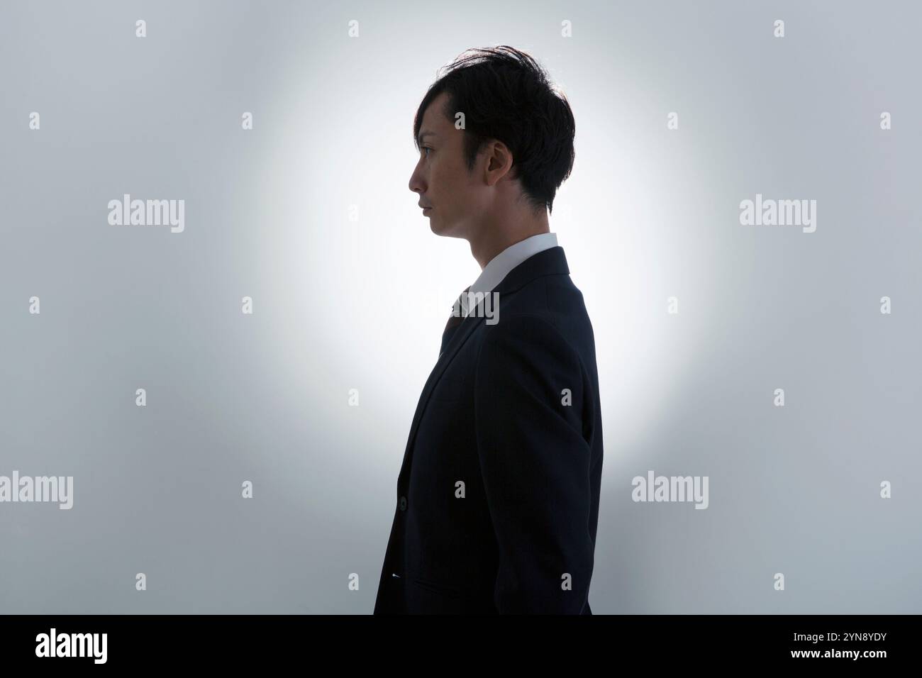 Profile of man in suit Stock Photo - Alamy