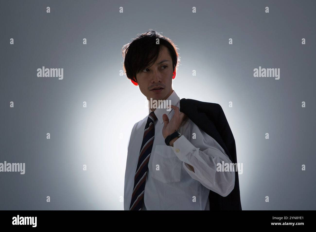 Side view of man with suit on his shoulder Stock Photo - Alamy