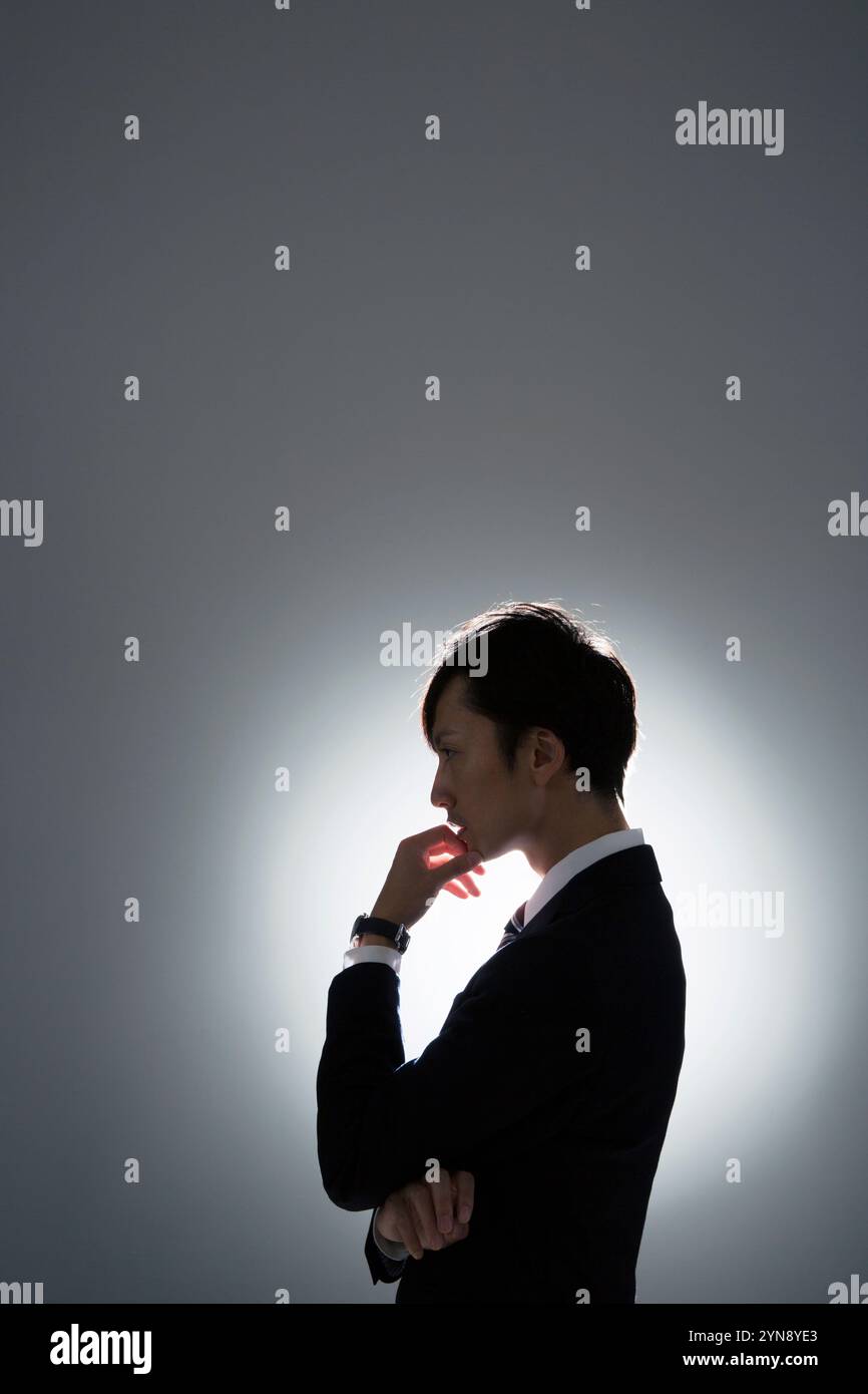 Thinking male profile Stock Photo - Alamy