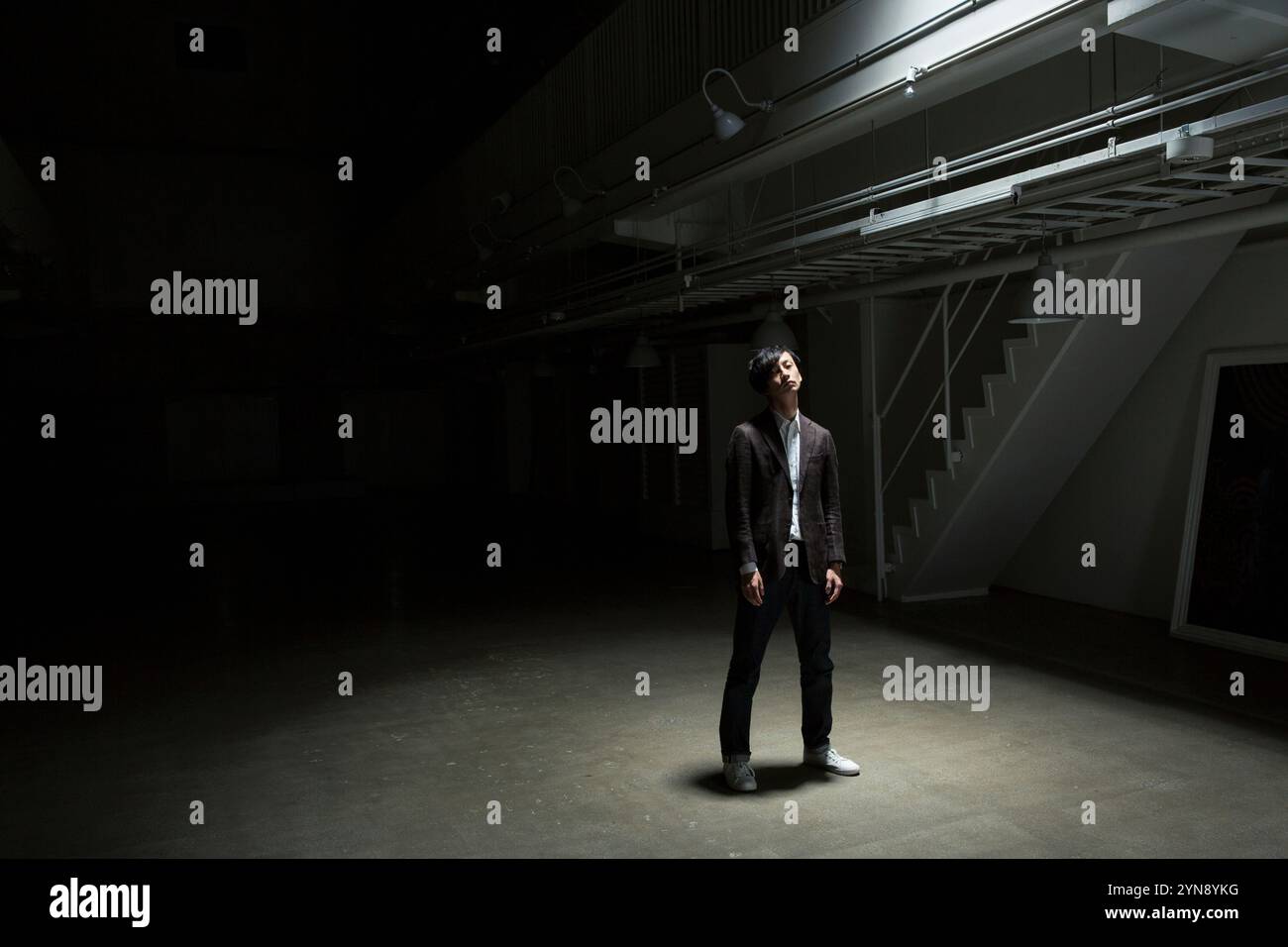 Man standing in the dark hi-res stock photography and images - Alamy
