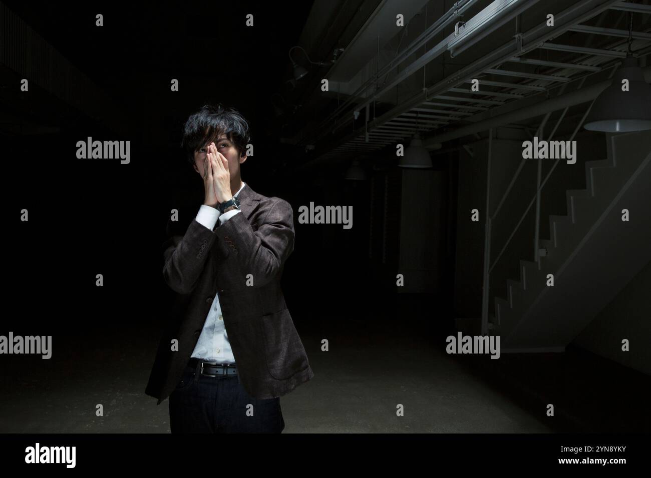 Shadow man hiding hi-res stock photography and images - Alamy