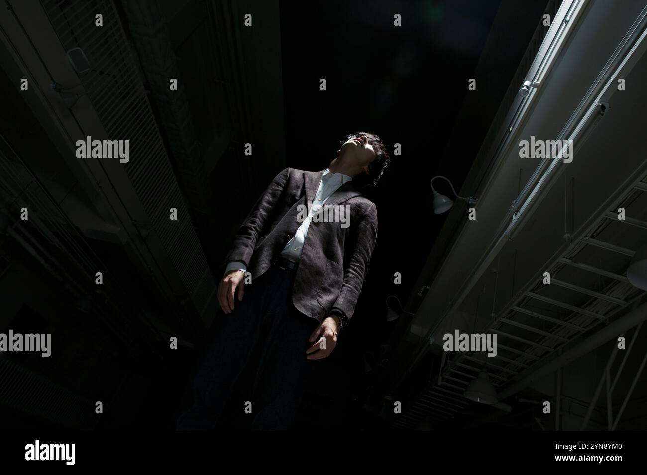 Man standing in the dark Stock Photo - Alamy