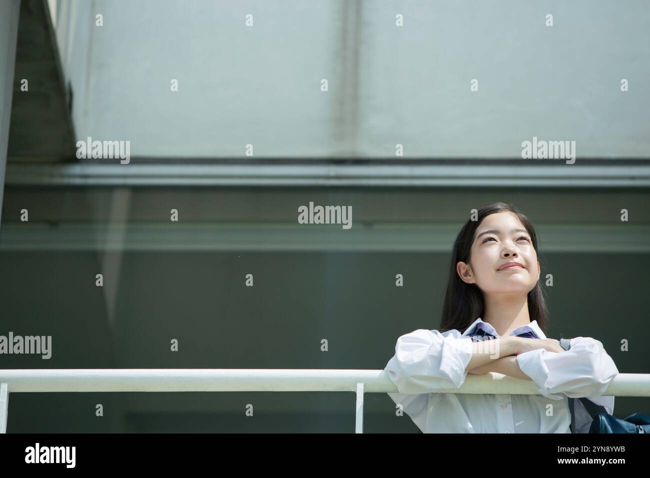 High school girl standing on balcony at school Stock Photo - Alamy