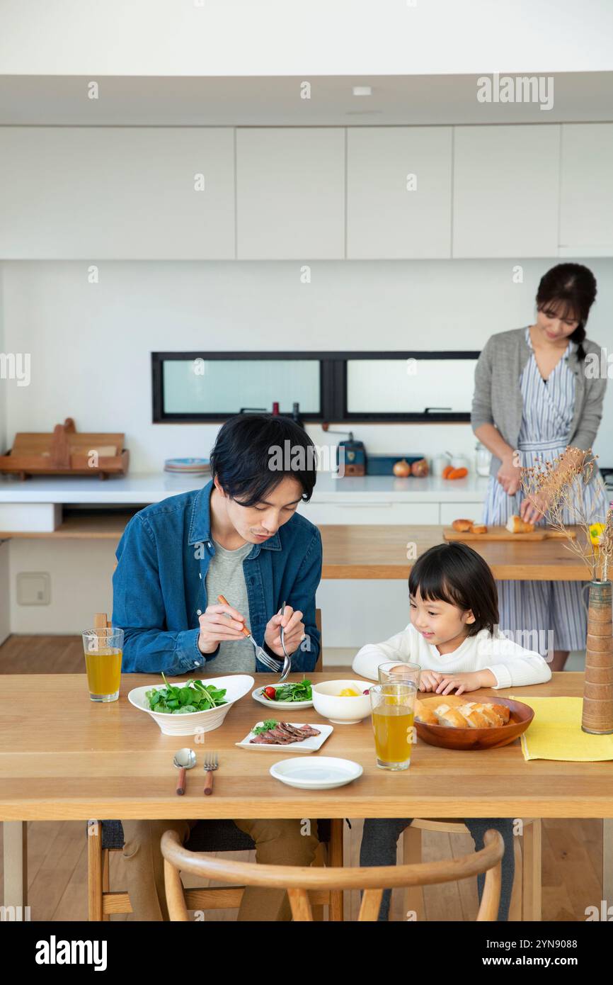 Happy family dining scene Stock Photo - Alamy