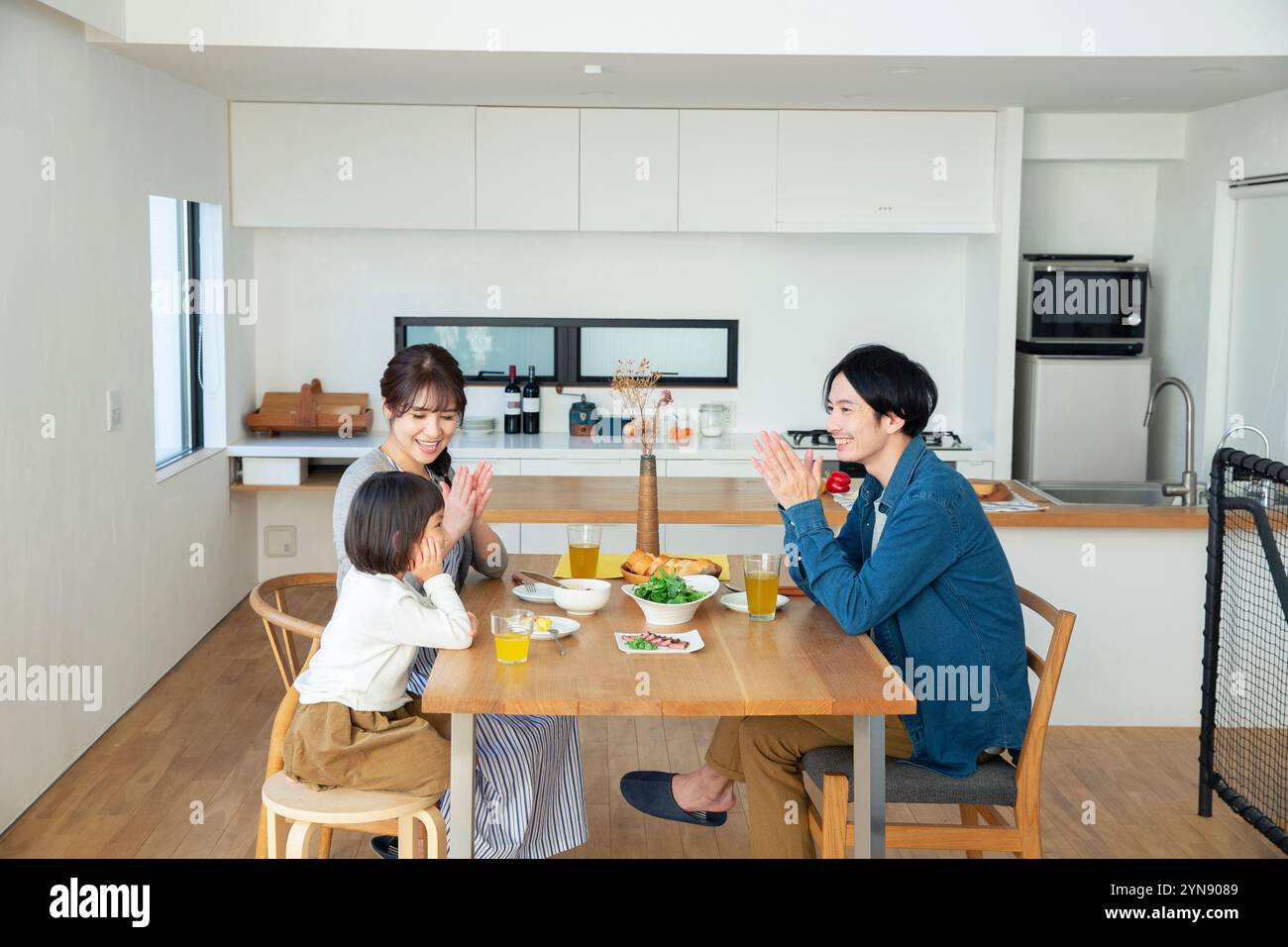 Happy family dining scene Stock Photo - Alamy
