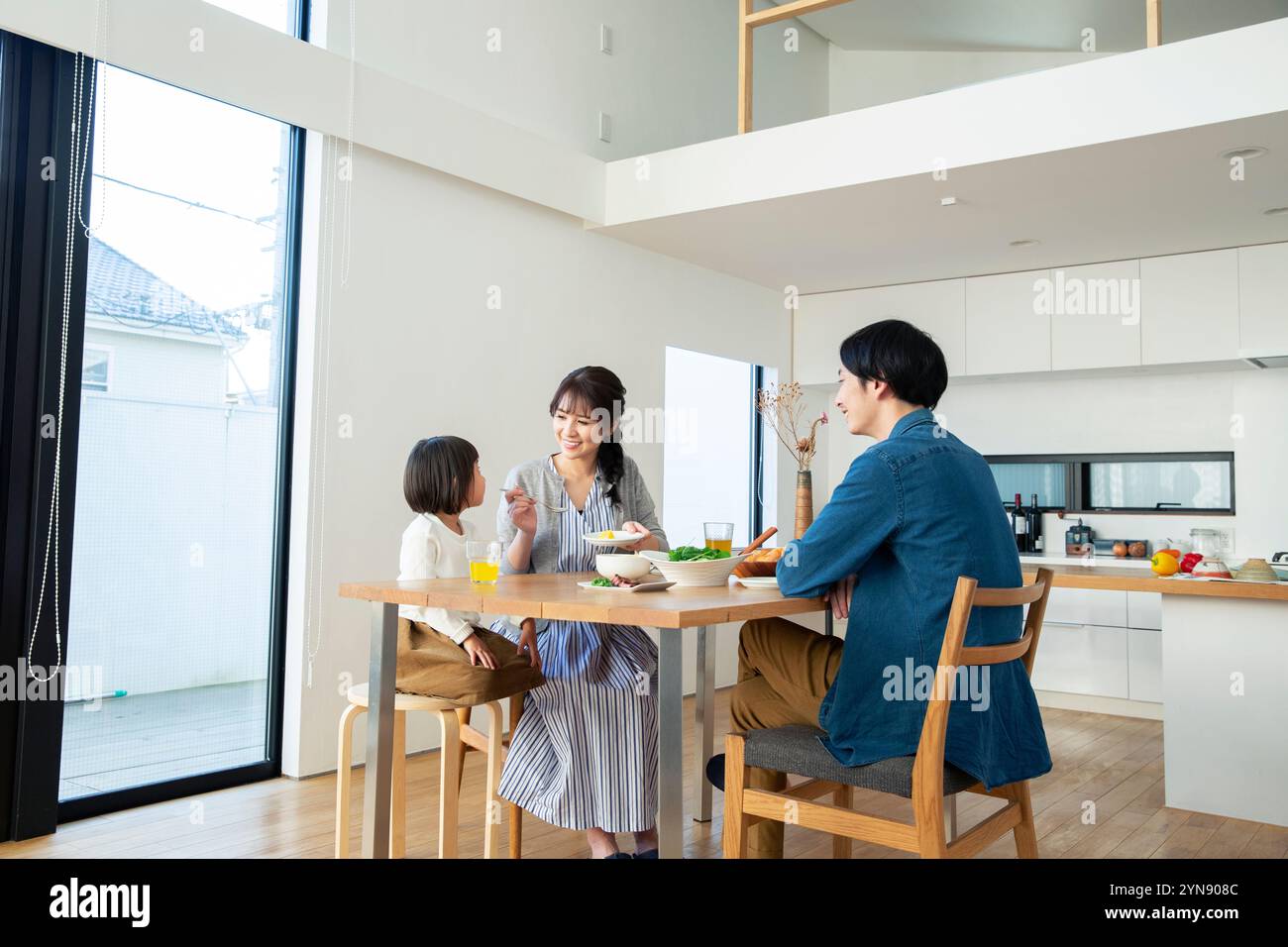Happy family dining scene Stock Photo - Alamy