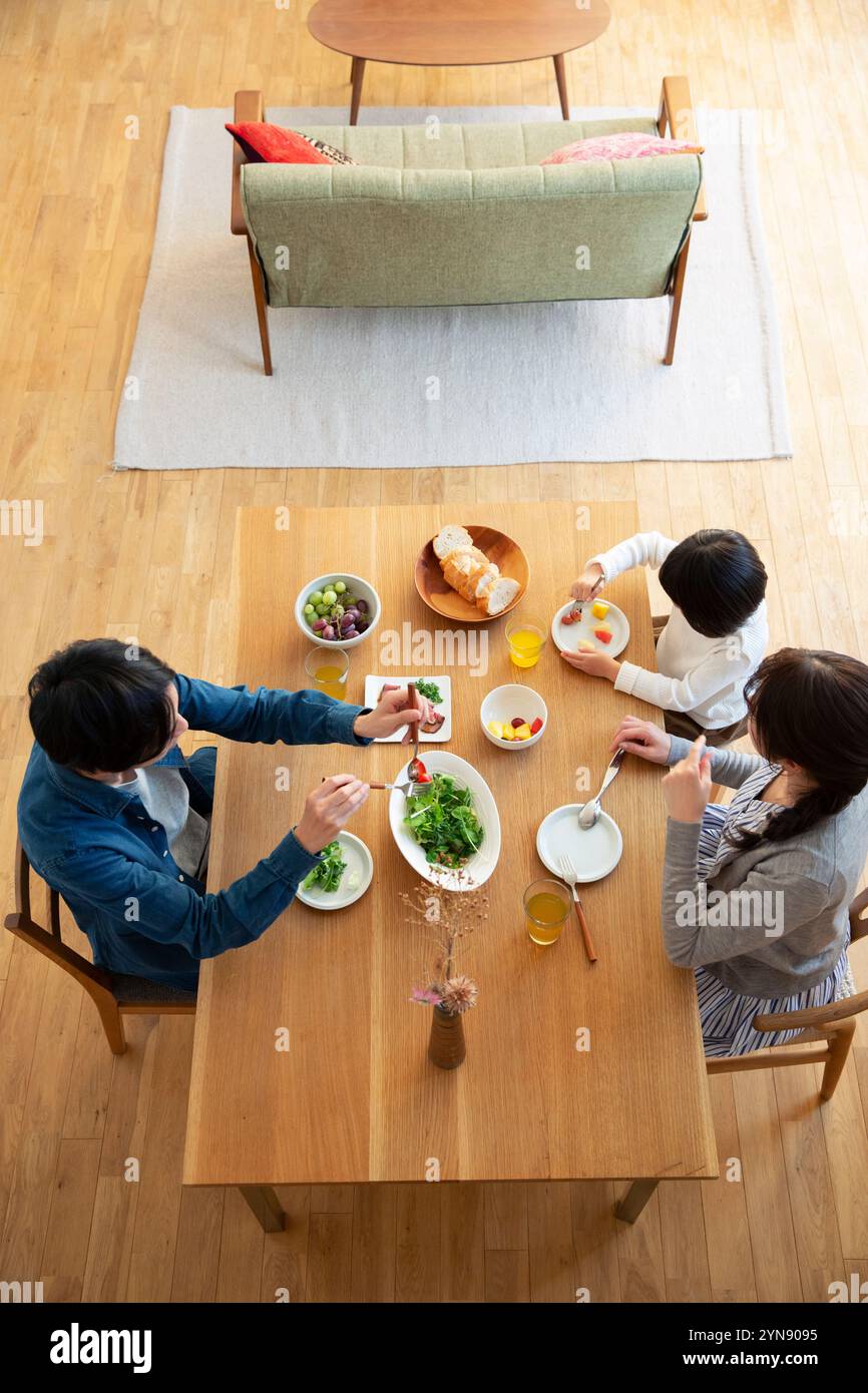 Happy family dining scene Stock Photo - Alamy
