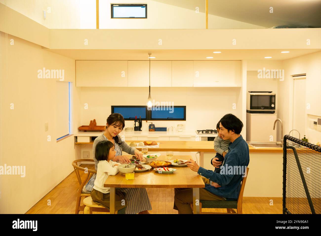 Happy family dining scene Stock Photo - Alamy