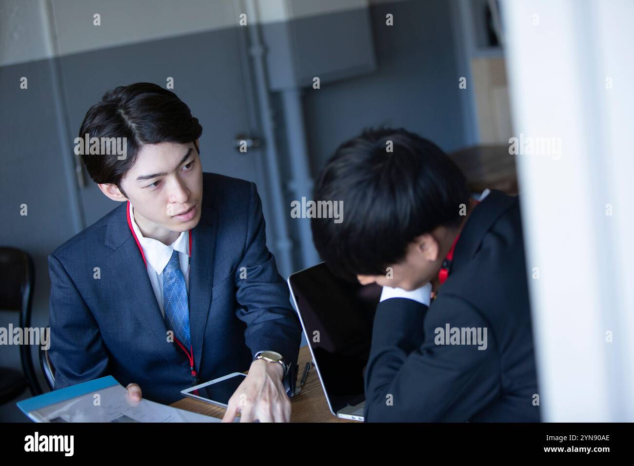 Two men in their 20s having a meeting Stock Photo - Alamy