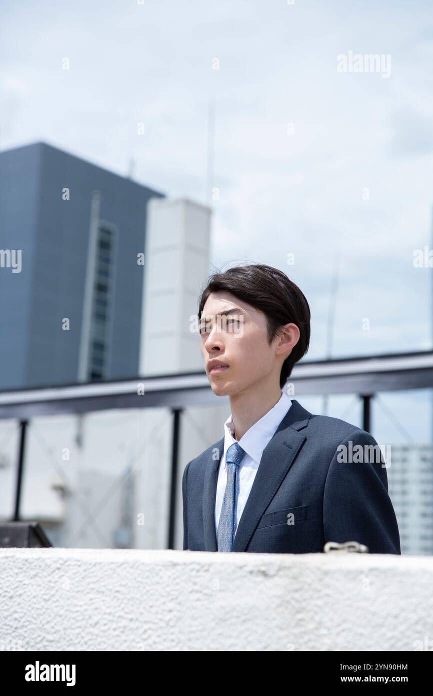 Business man standing on rooftop hi-res stock photography and images ...