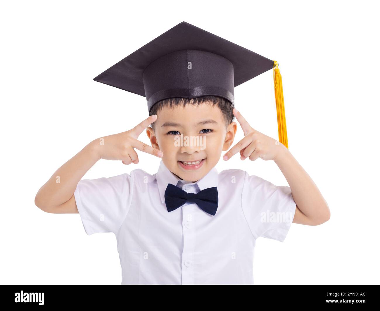 child wearing graduation cap with happy face smiling doing looking sign ...