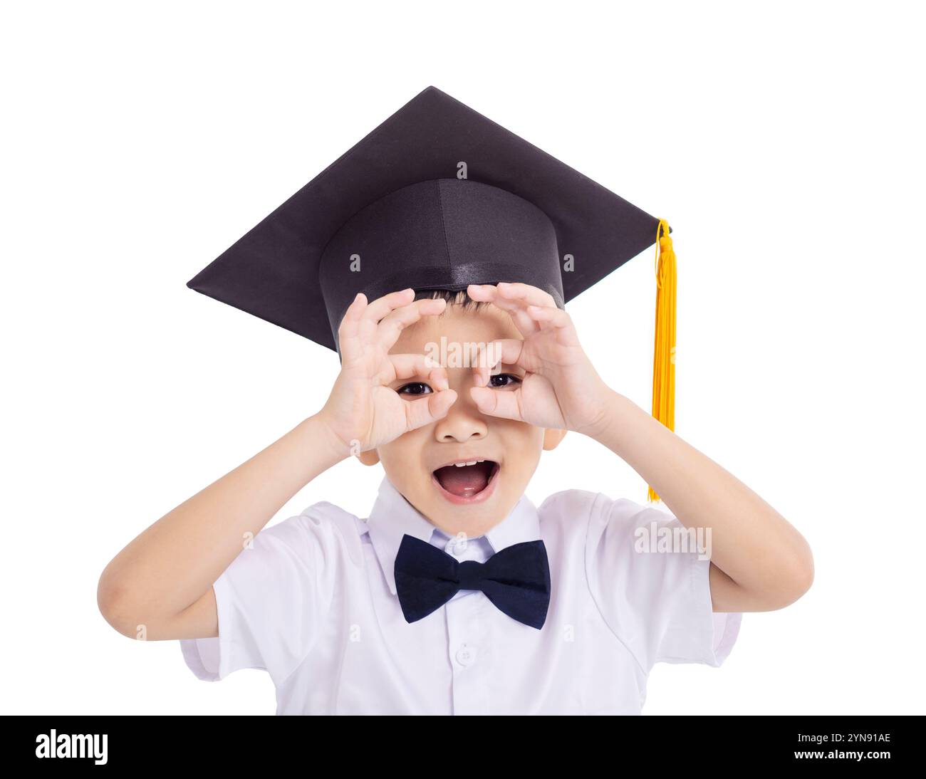 child wearing graduation cap with happy face smiling doing ok sign with ...
