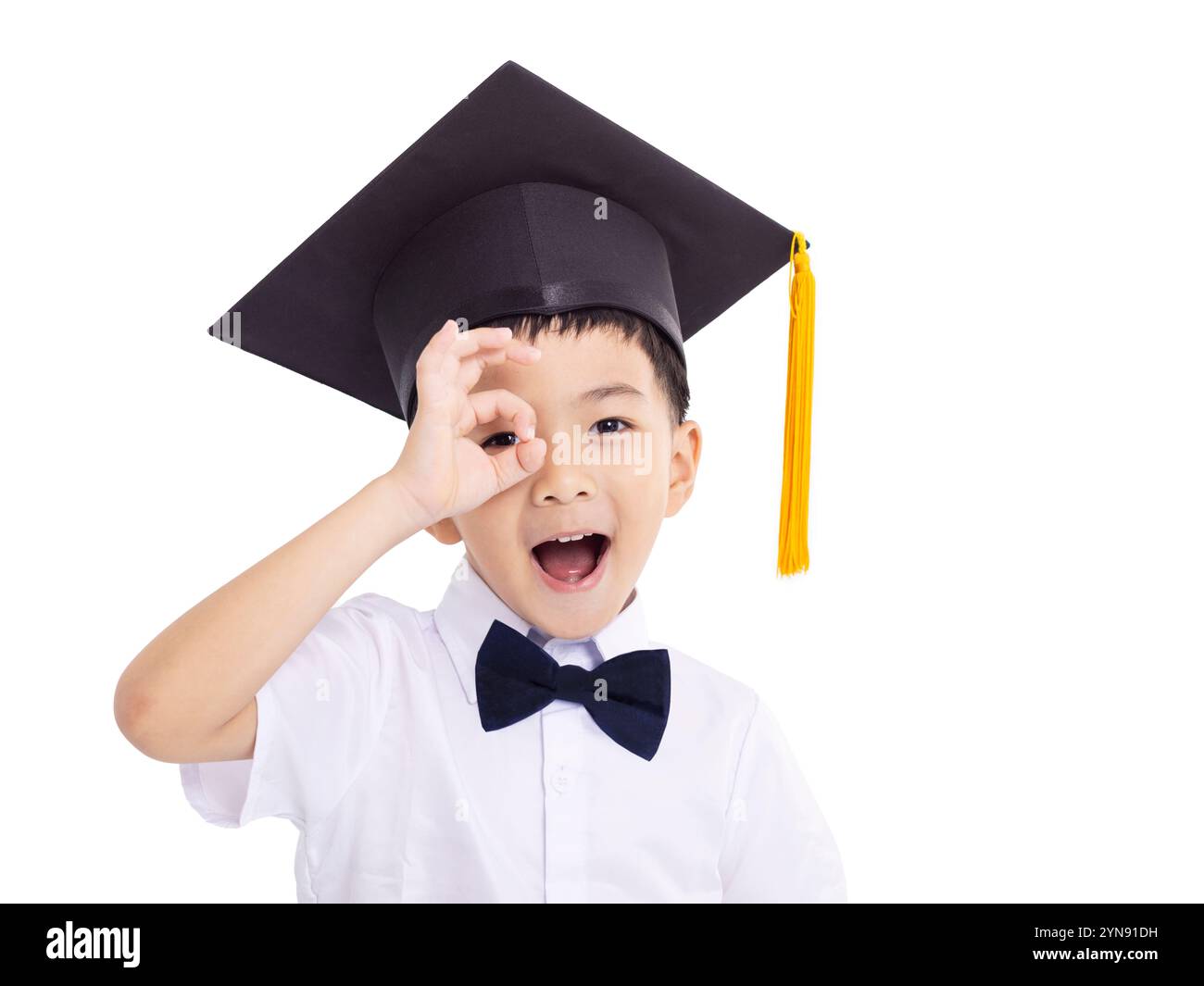 child wearing graduation cap with happy face smiling doing ok sign with ...