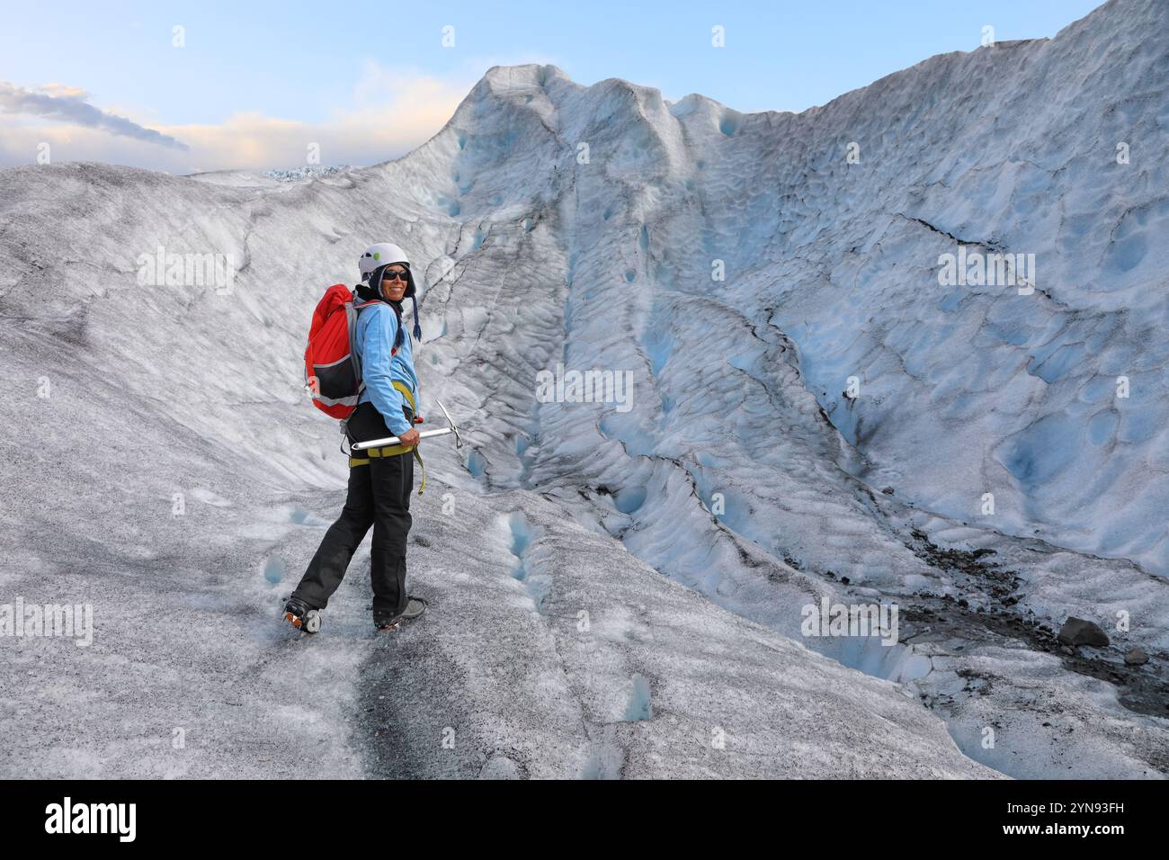 Woman climber standing in the cleft of the Falljokull Glacier (Falling ...